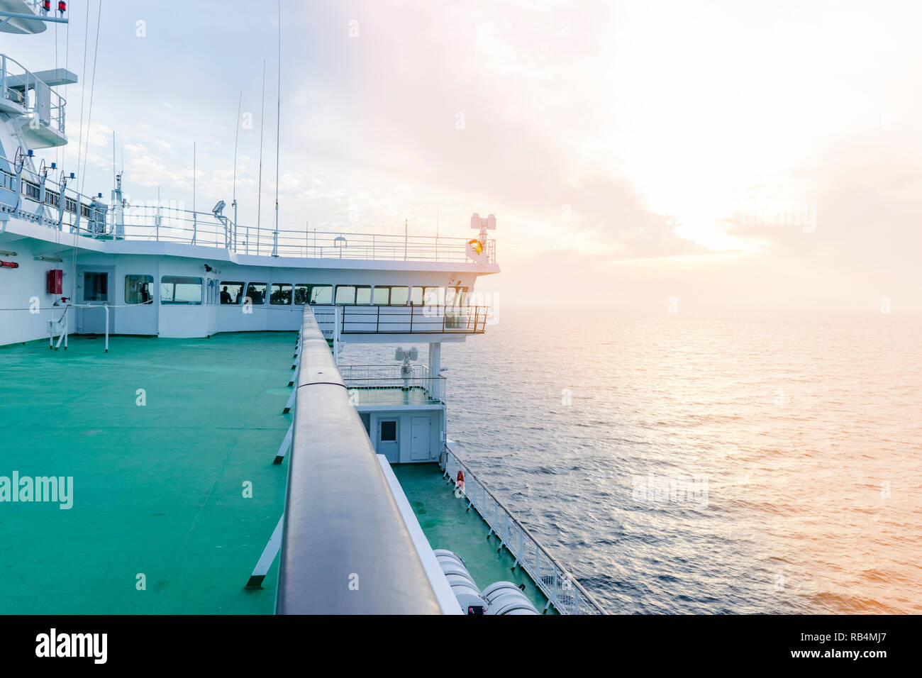 Cruise ship white cabin with big windows. Wing of running bridge of ...