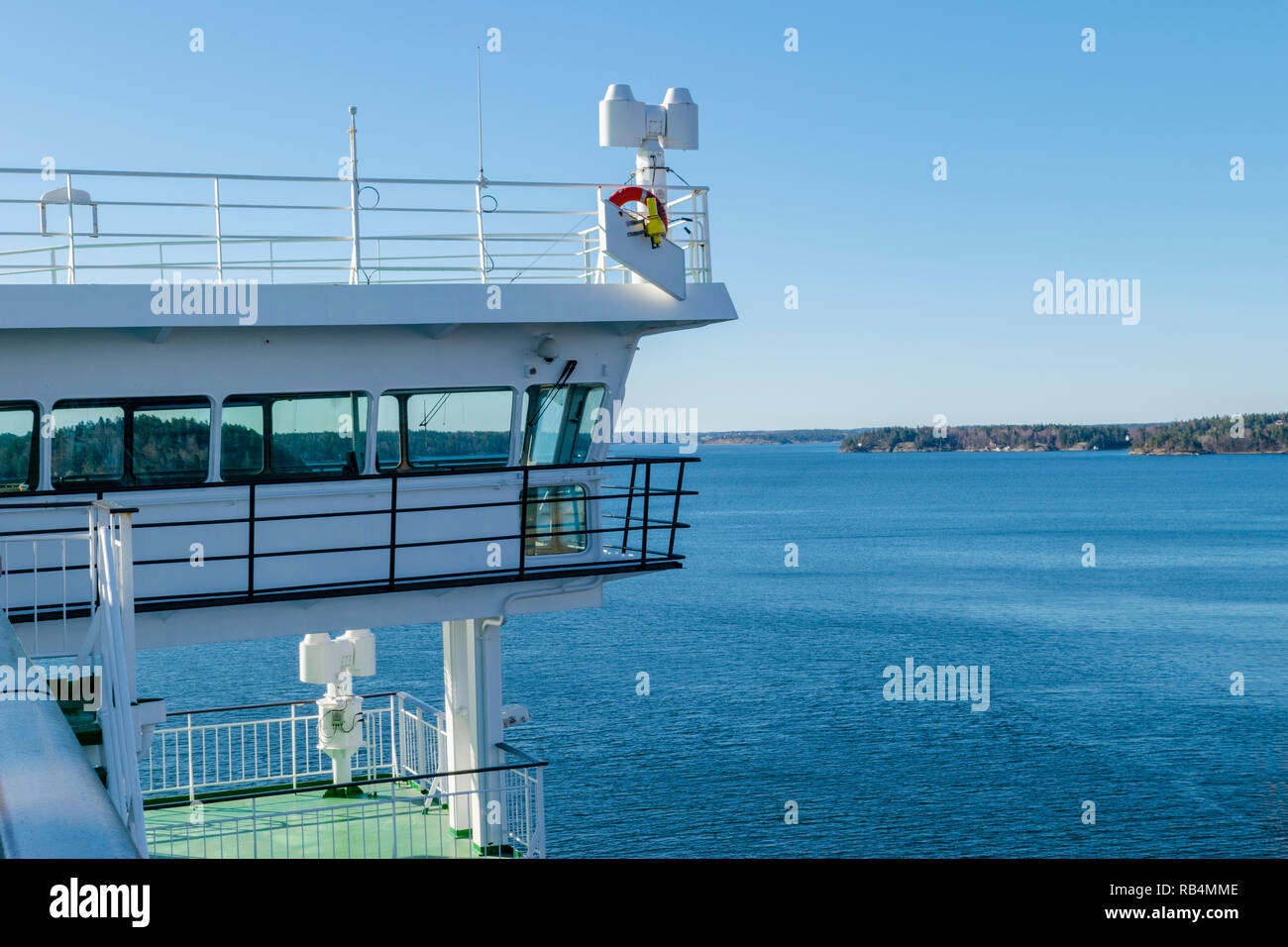Cruise ship white cabin with big windows. Wing of running bridge of ...