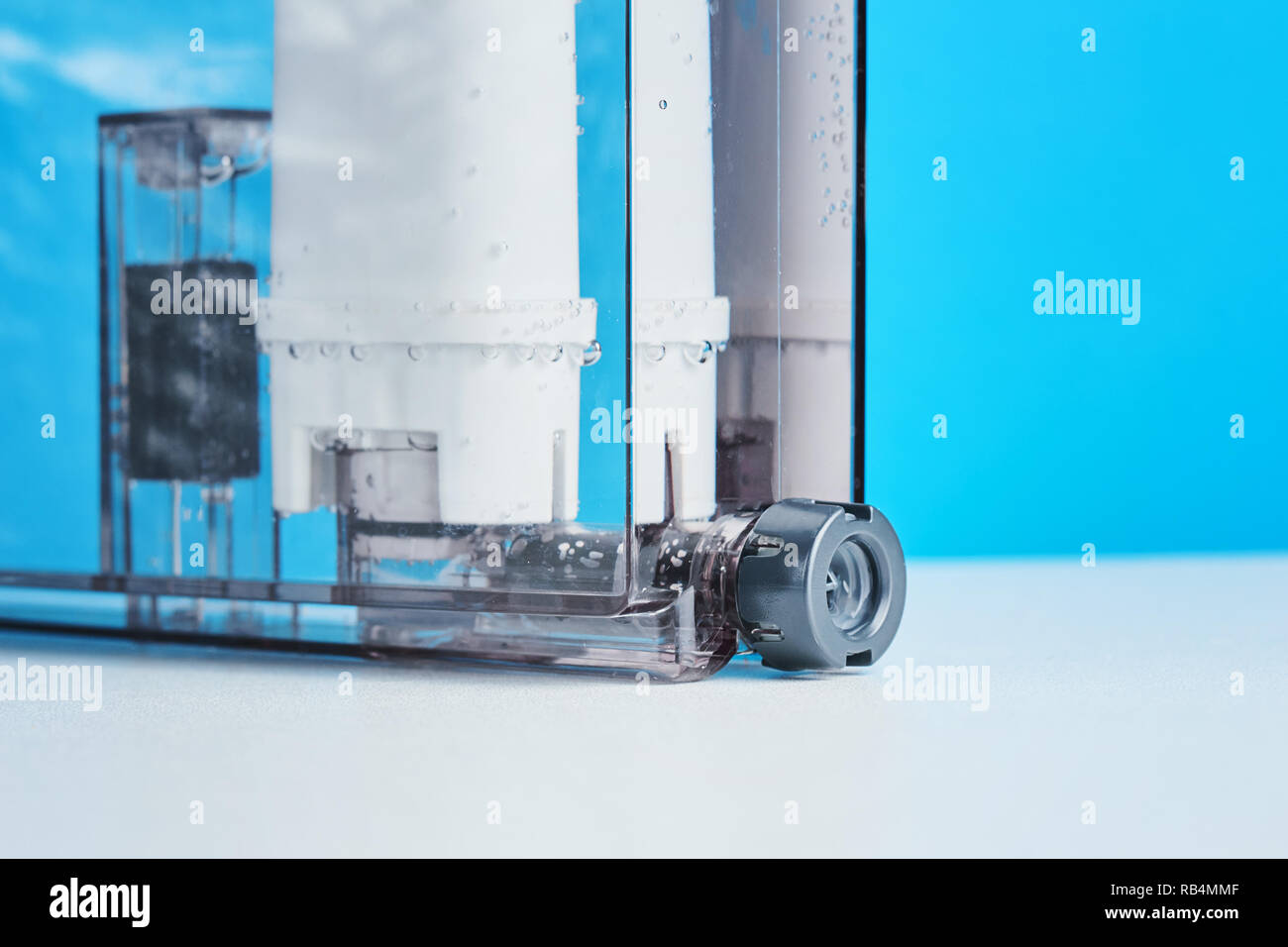 Filter water purification in coffee machine container. Kitchen ...