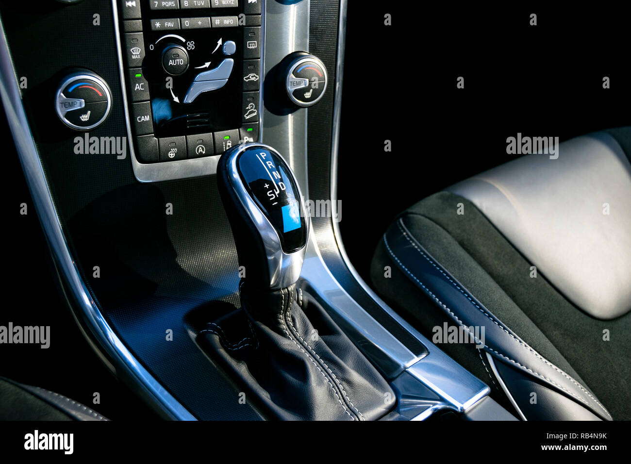 automatic gear stick of a modern car, car interior details with ...