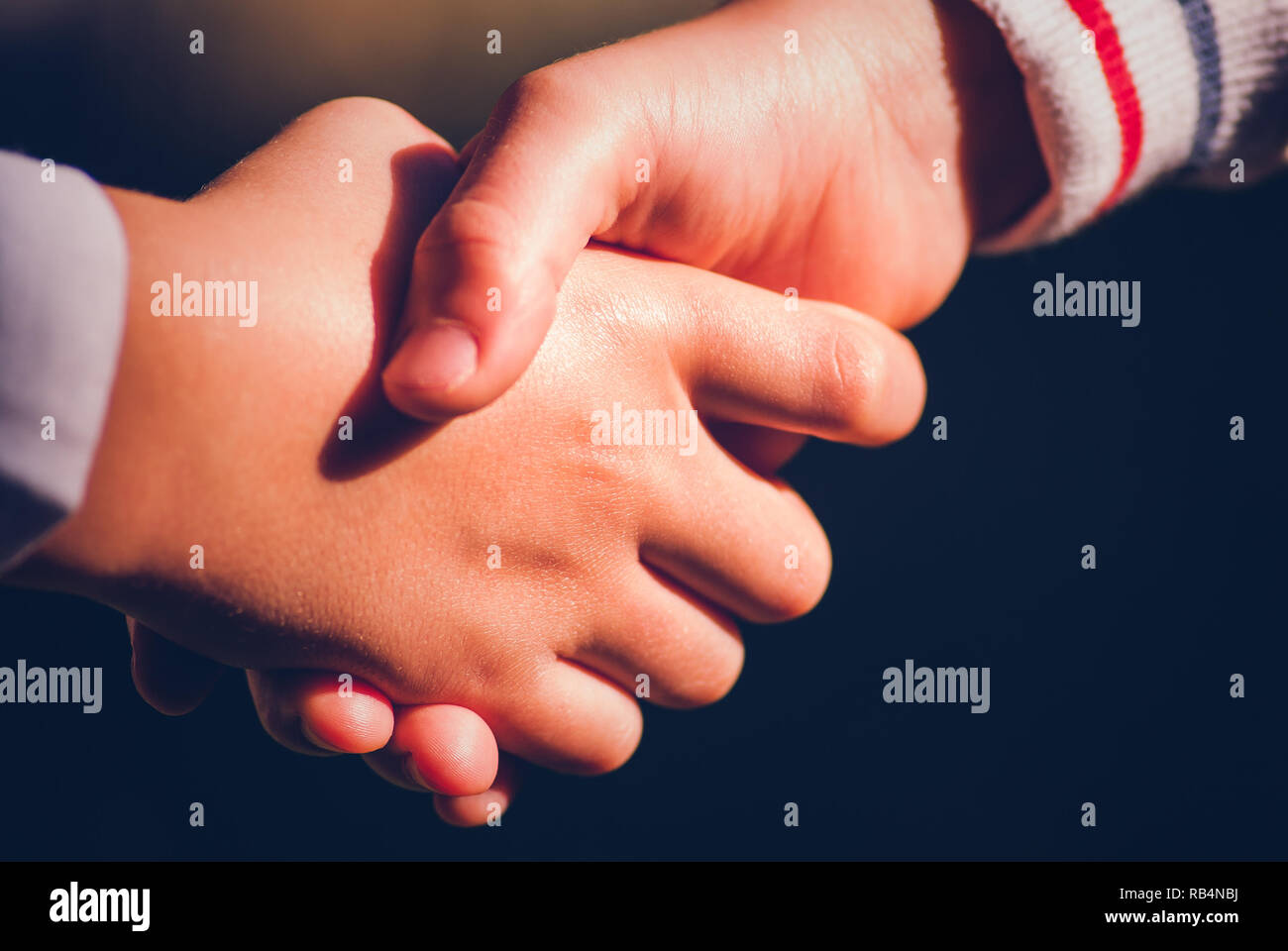 little childrens friends handshake - sensory connections Stock Photo ...