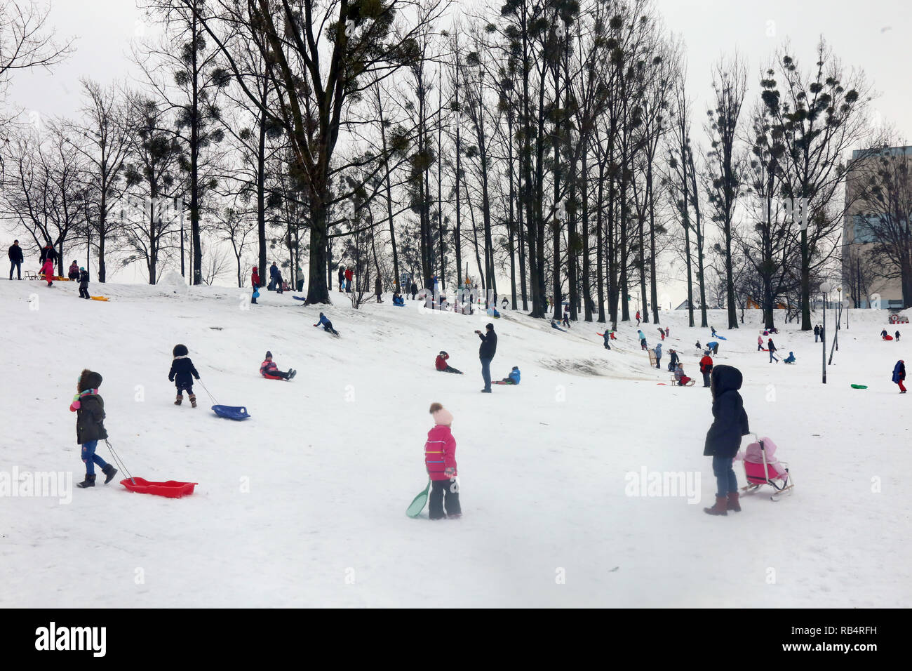 Parents with children spend Saturdays afternoon enjoying the charms of ...