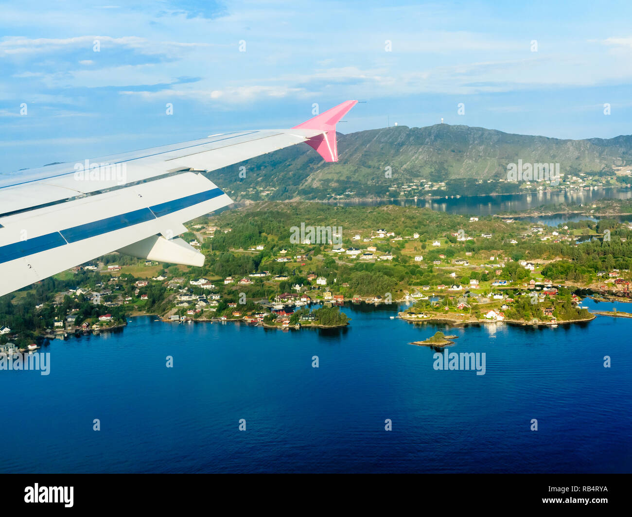 Birds eye. View from window of plane airplane flying over fjords Norway ...