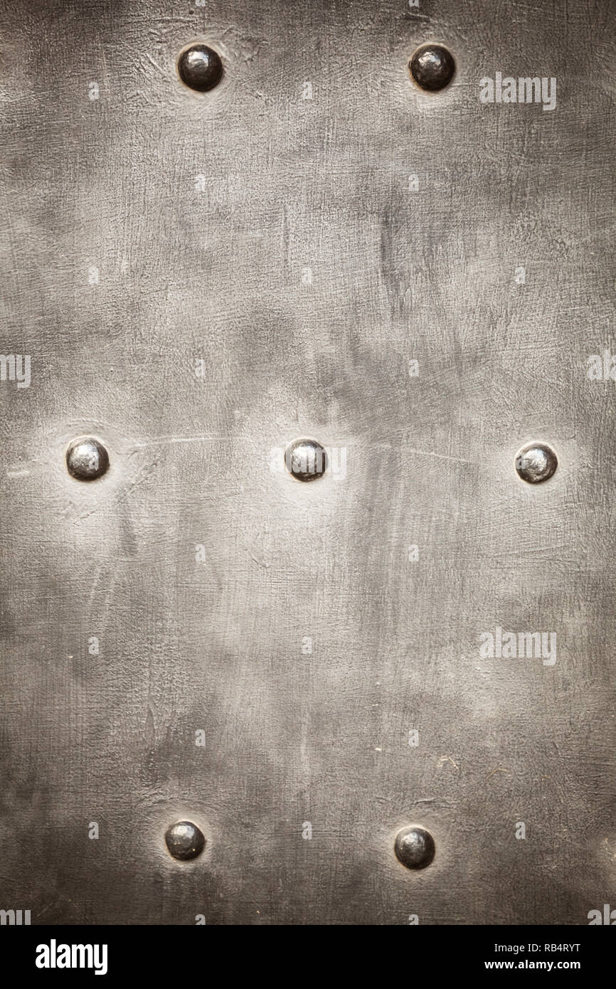 grunge metal plate or armour texture with rivets as background Stock ...