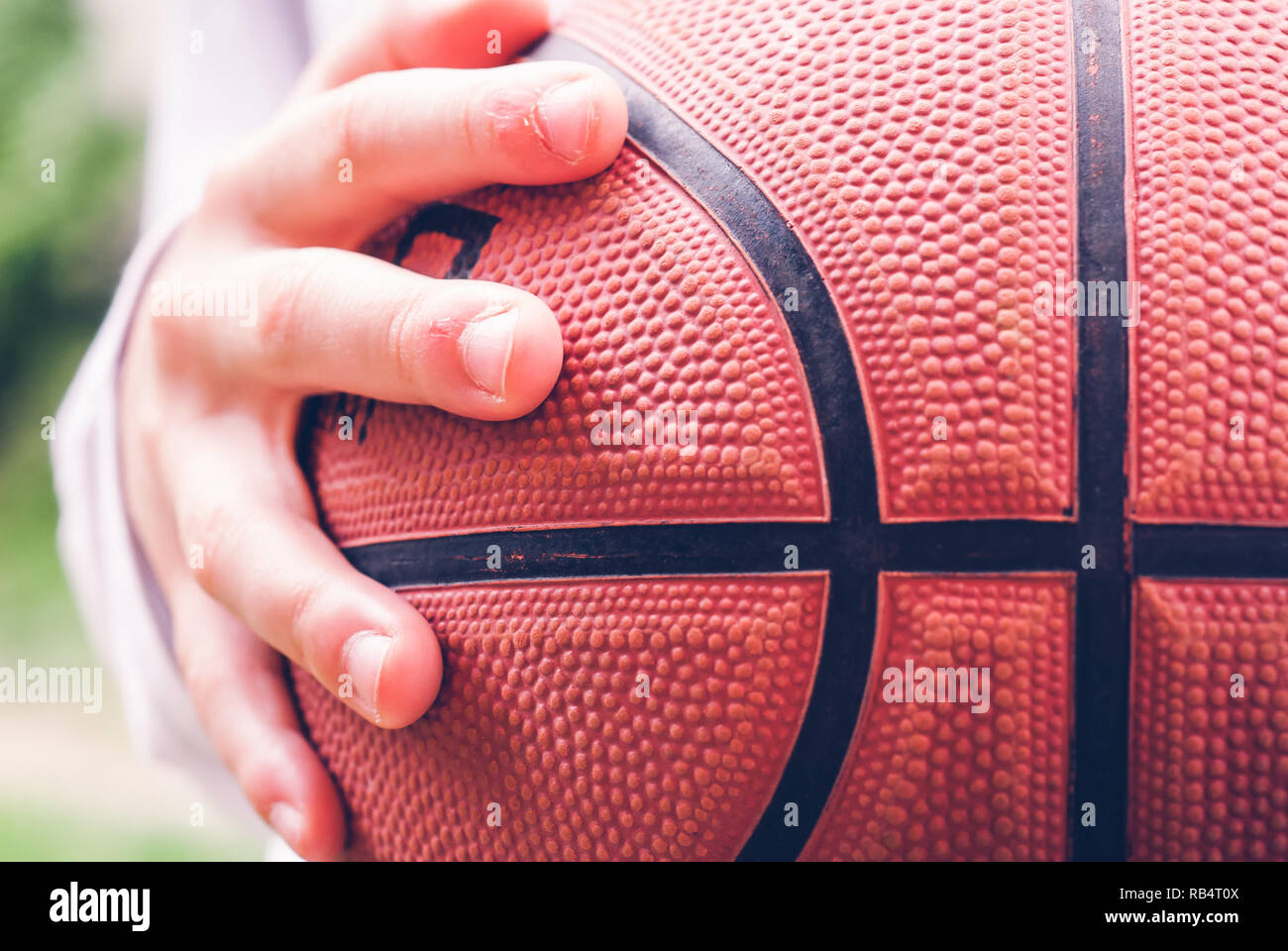 little child hand basketball player outdoor - sensory connections Stock ...