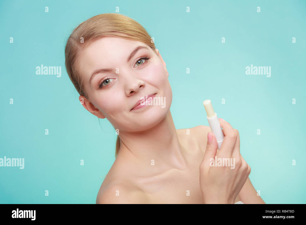 Female putting applying lip balm moisturizing balsam. Girl taking care ...