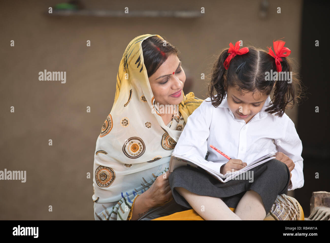 Indian rural mother child study hi-res stock photography and images - Alamy