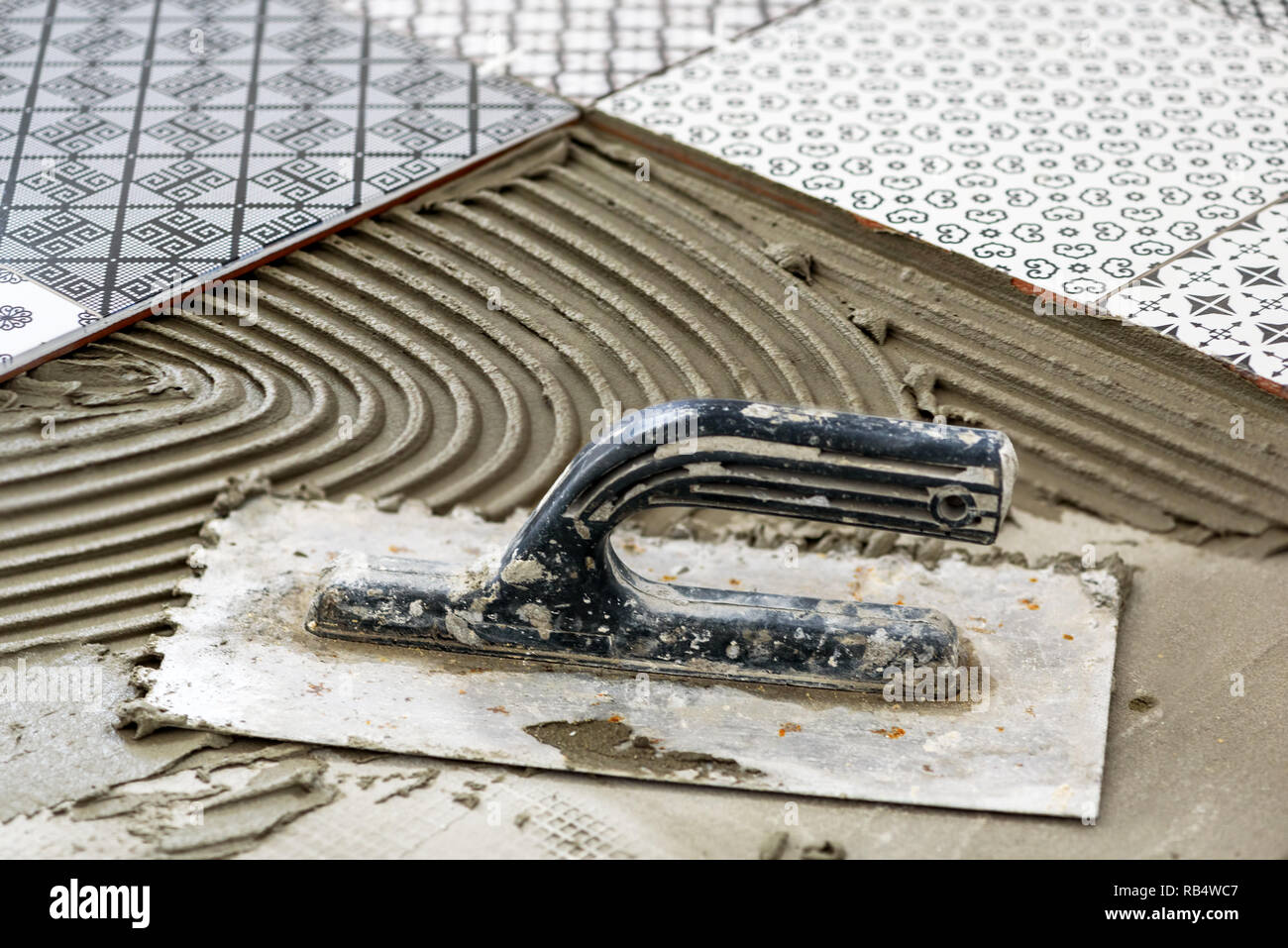 Ceramic tiles and tools for tiler. Floor tiles installation Stock Photo ...