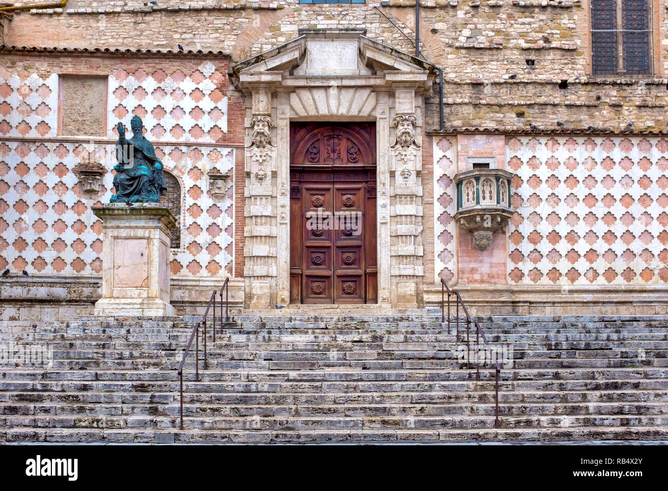 South wall of Perugia’s Cathedral with the statue of Pope Julius III ...