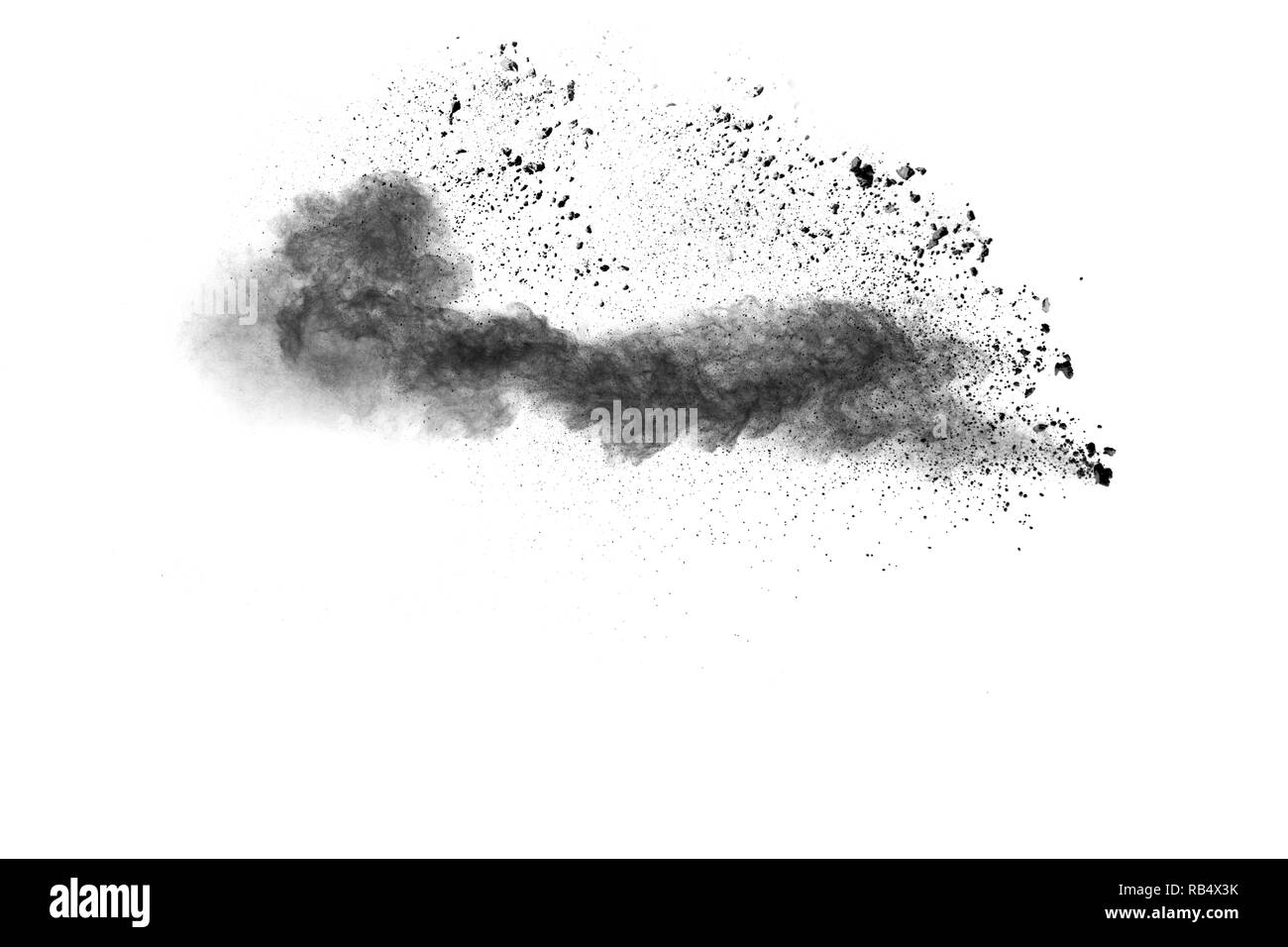 Black powder explosion against white background. Charcoal dust particle ...