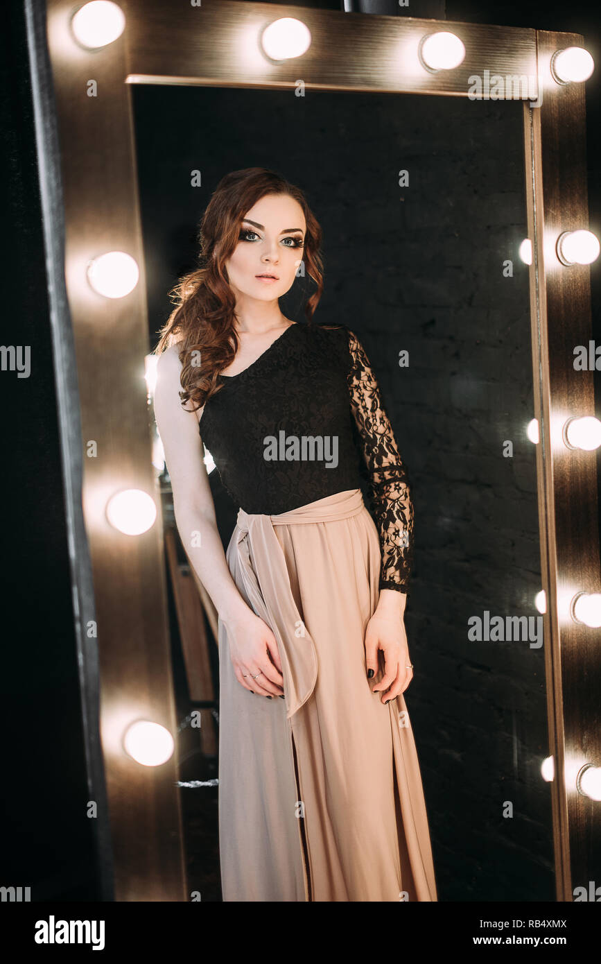 Individuality. Thoughtful Elegant Lady in Black Prom Dress standing ...