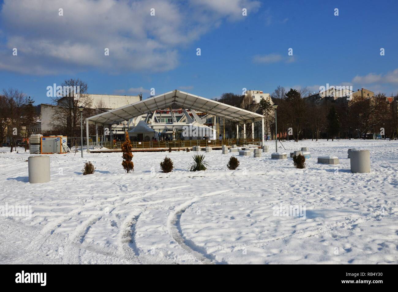Open skating rink covered in the open air in town Stock Photo - Alamy
