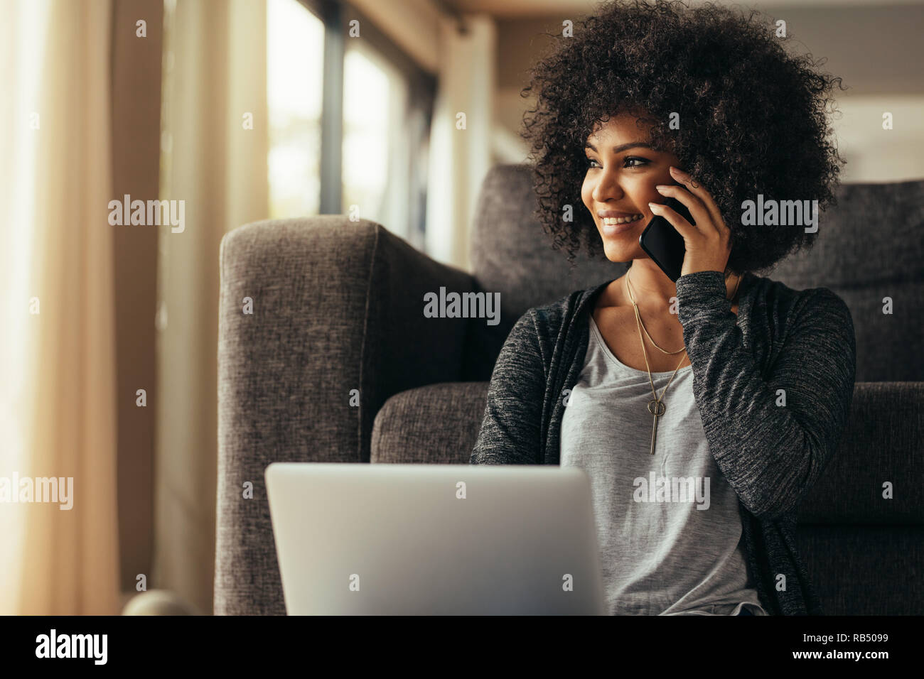 Female home talking phone smiling hi-res stock photography and images ...