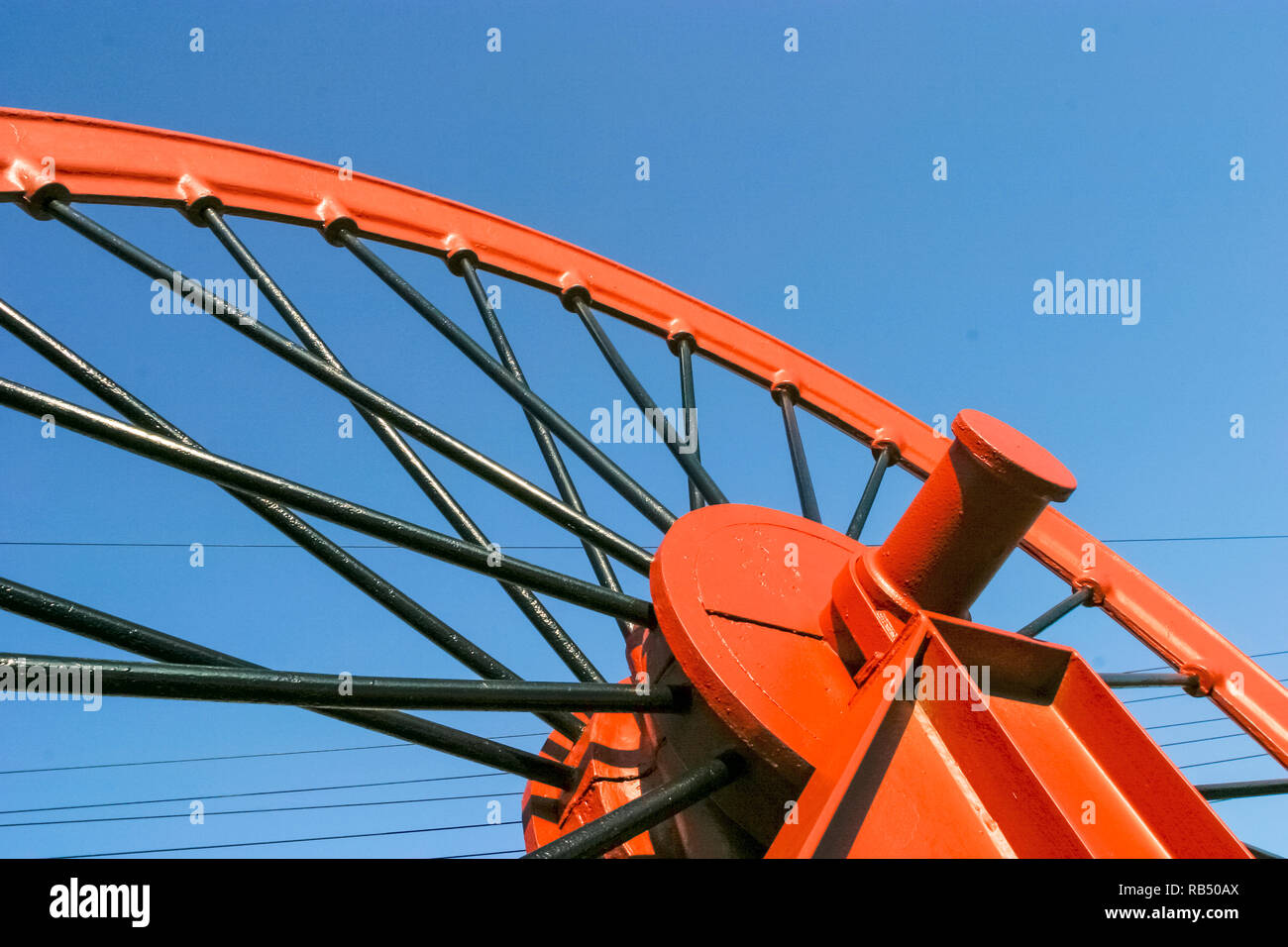 Old mine pit head wheel used as a monument at the entrance to Woodhorn ...