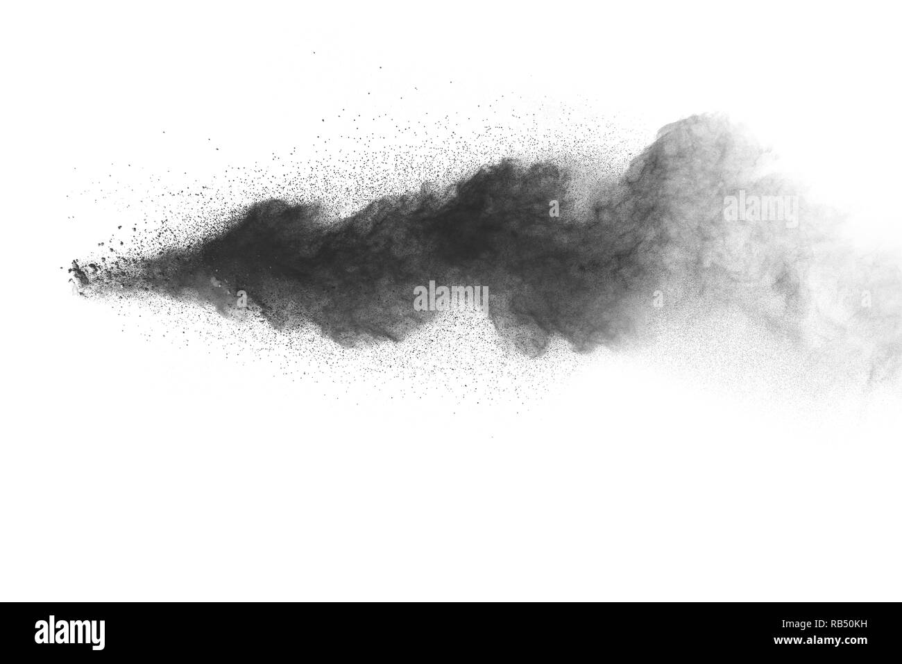 Black powder explosion against white background. Charcoal dust particle ...