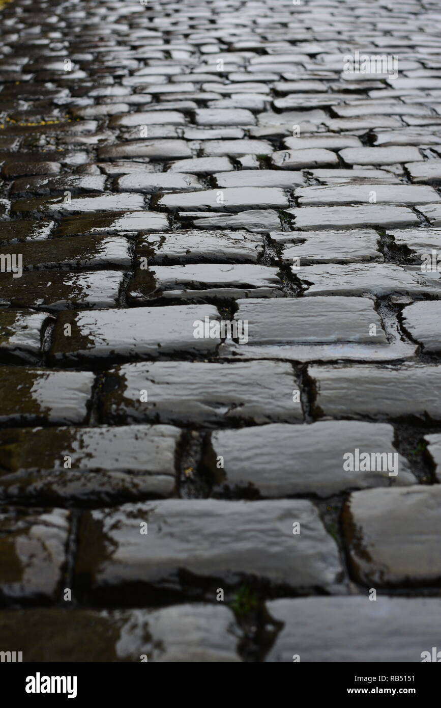 Rain soaked cobbled street hi-res stock photography and images - Alamy