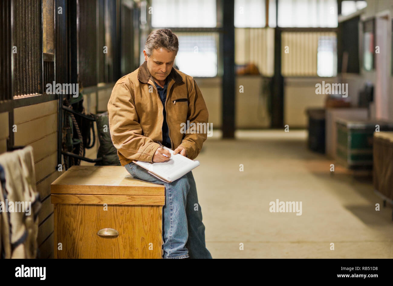 Man with a horse stables hi-res stock photography and images - Alamy