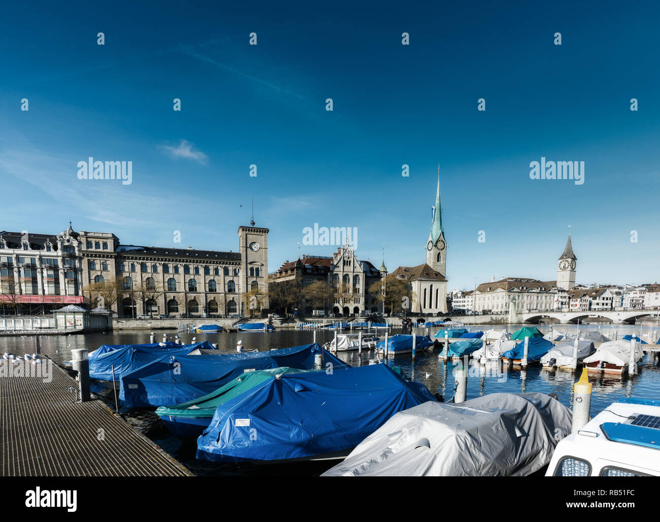 Zurich cityscape with the river Limmat and docked boats and the ...