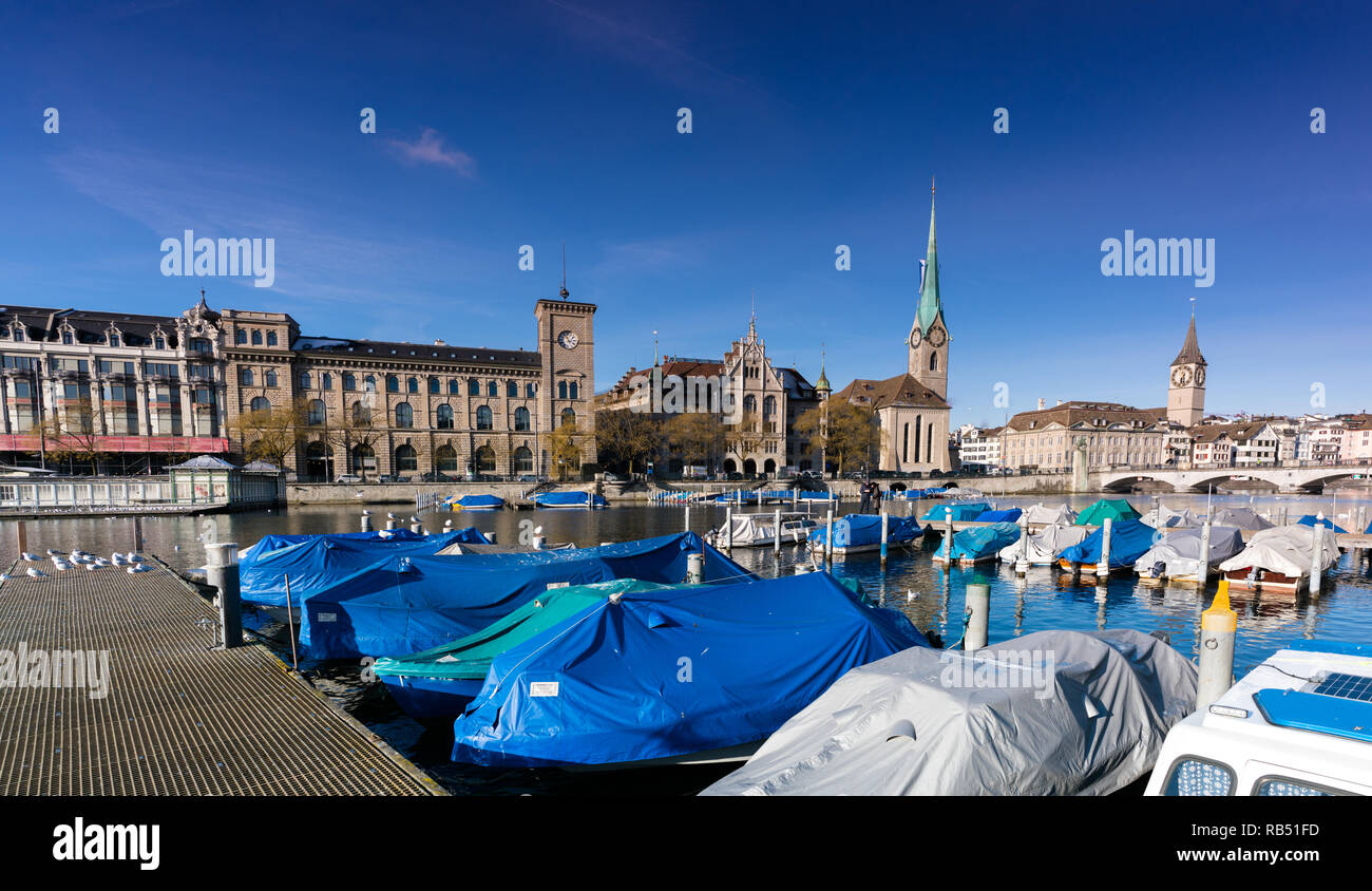 Zurich cityscape with the river Limmat and docked boats and the ...