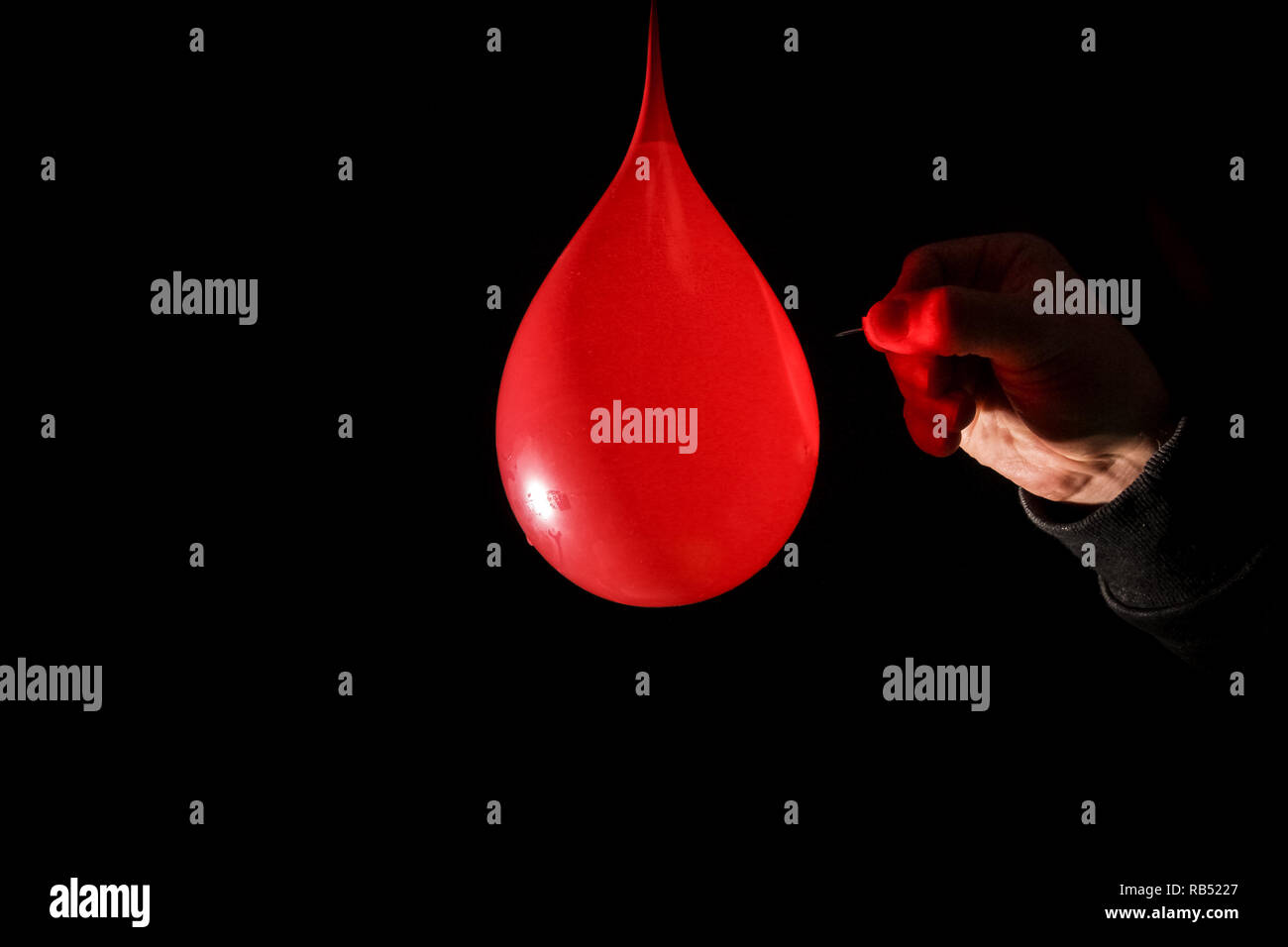 amazing explosion of isolated water balloon on black background with ...