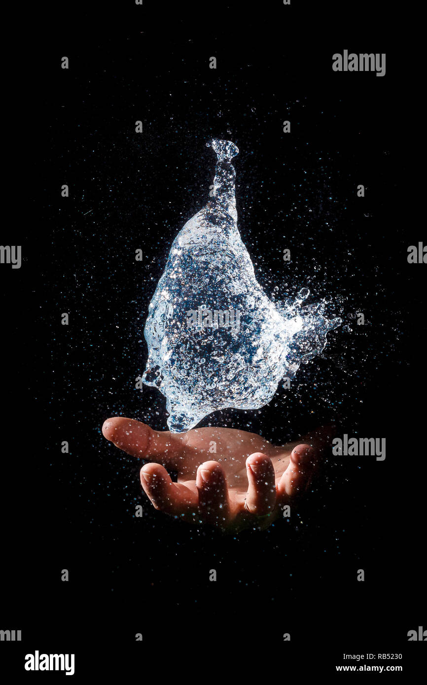 amazing explosion of isolated water balloon on black background with ...