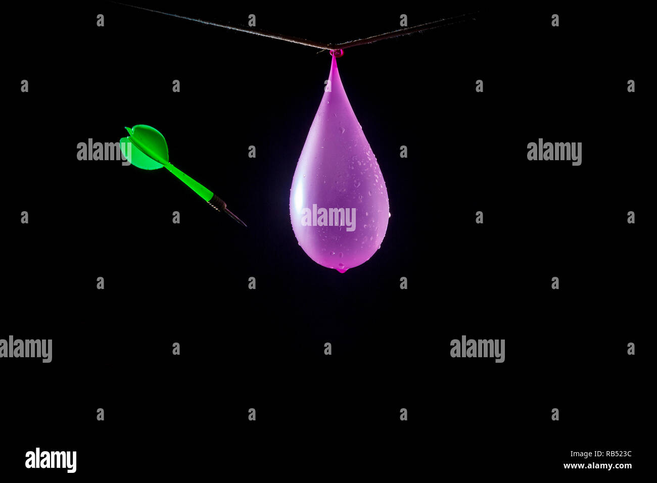 amazing explosion of isolated water balloon on black background with ...