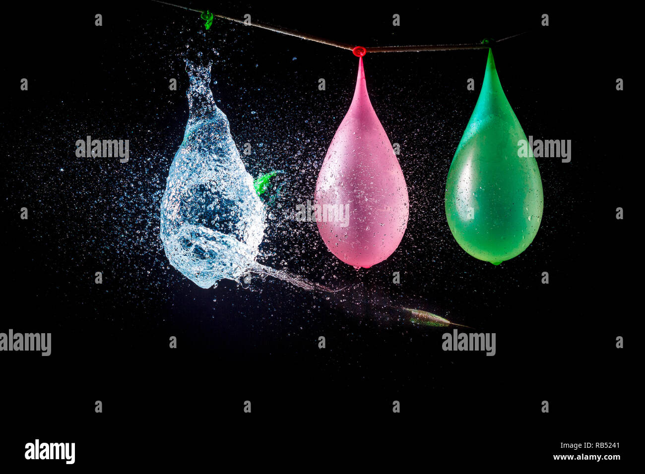 amazing explosion of isolated water balloon on black background with ...