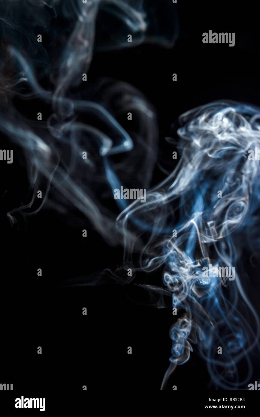 beautiful smoke on a black background in the dark Stock Photo - Alamy