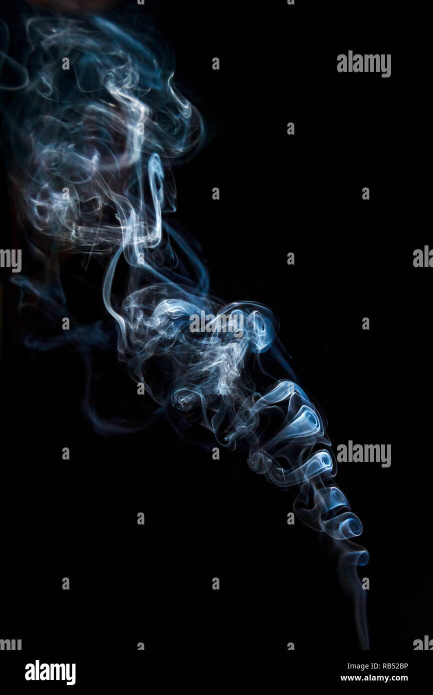 beautiful smoke on a black background in the dark Stock Photo - Alamy