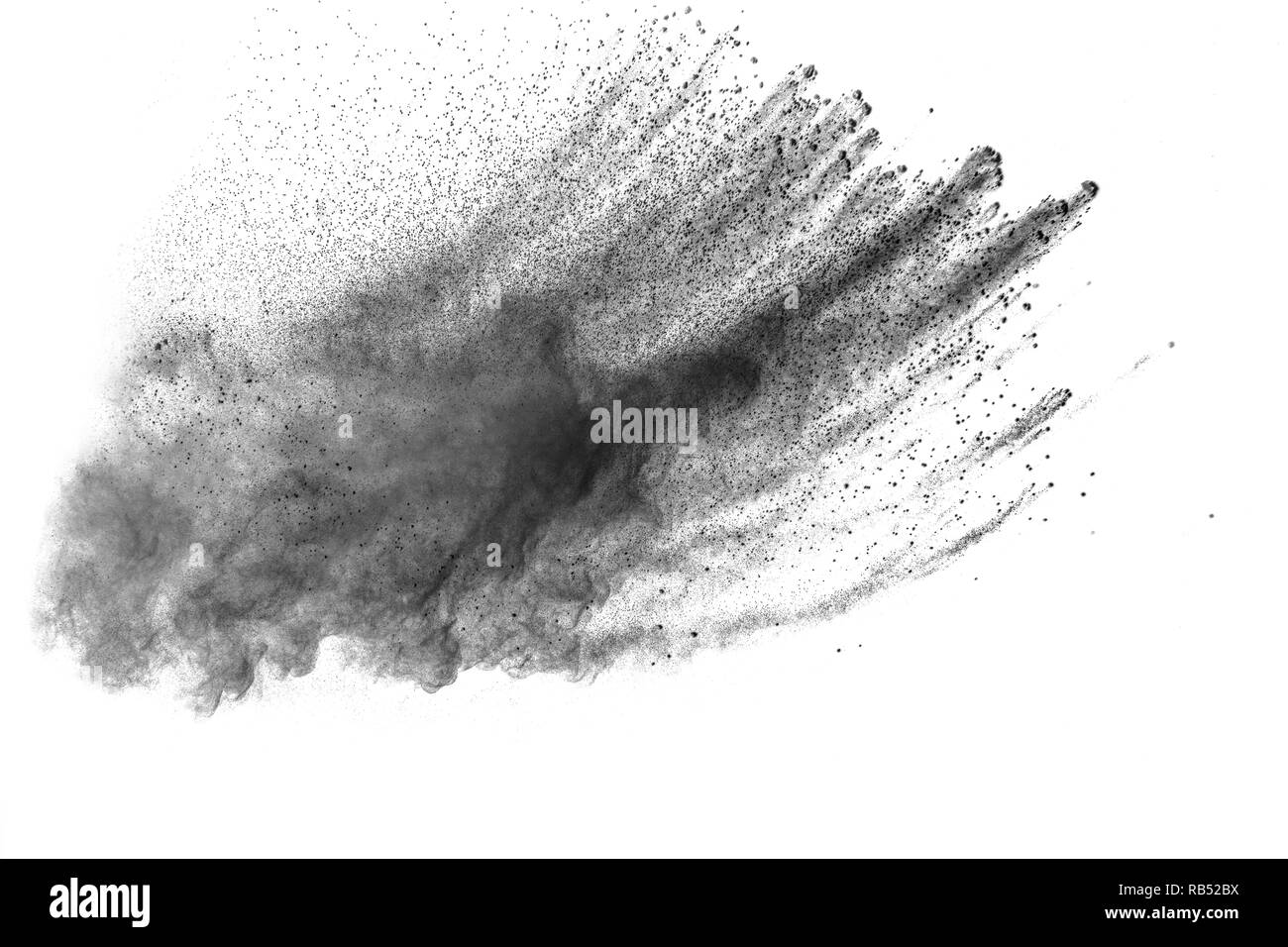 Black powder explosion against white background. Charcoal dust particle ...