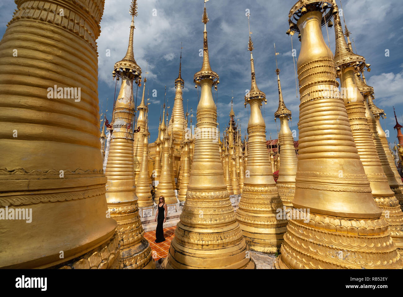 Inn Dein Pagoda, with a girl walking, Inle Lake, Myanmar Stock Photo ...