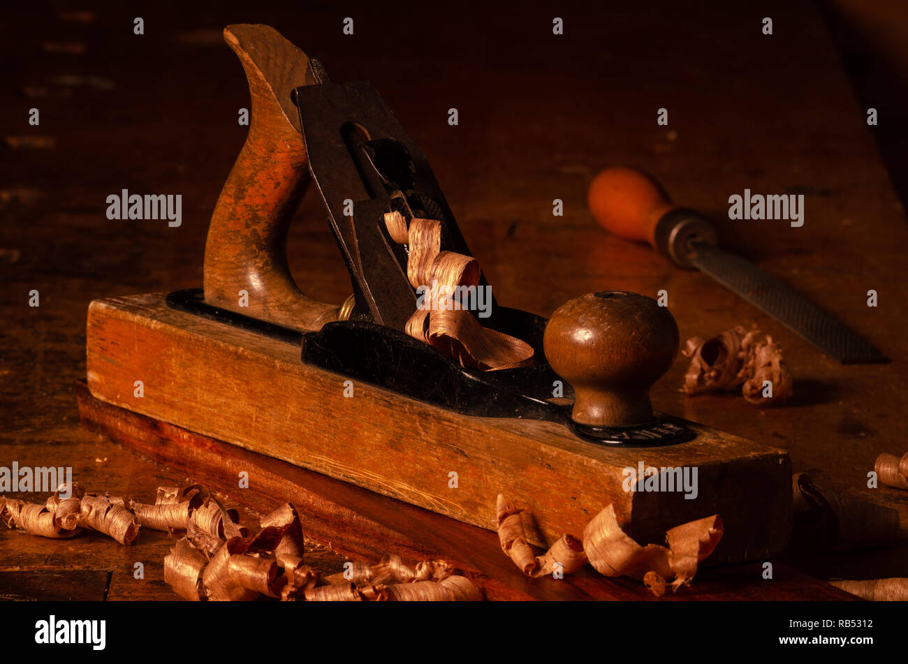 Woodworker's hand plane with wood shavings Stock Photo - Alamy