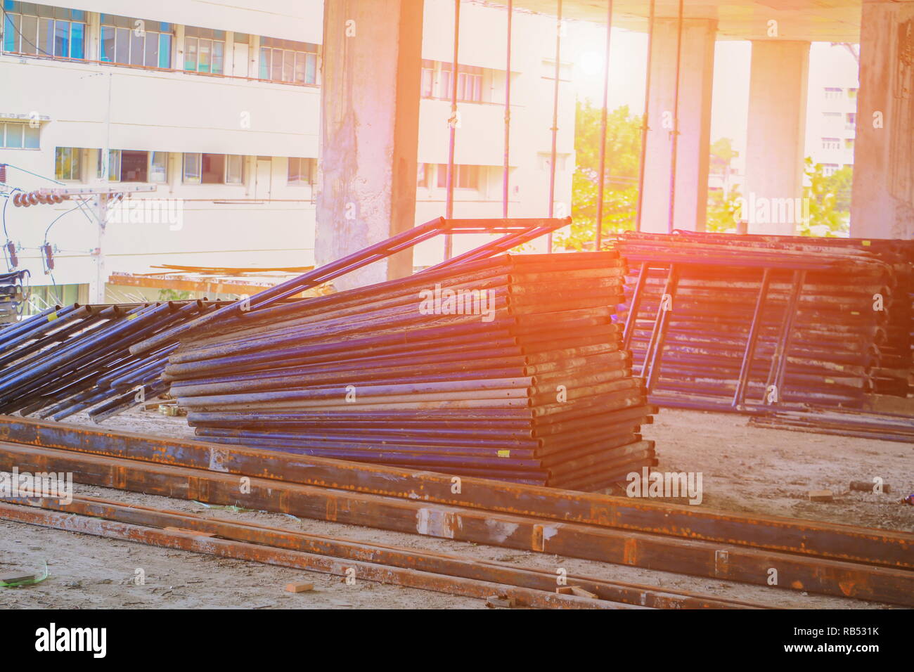 scaffolding steel group in work construction site building with sunset ...