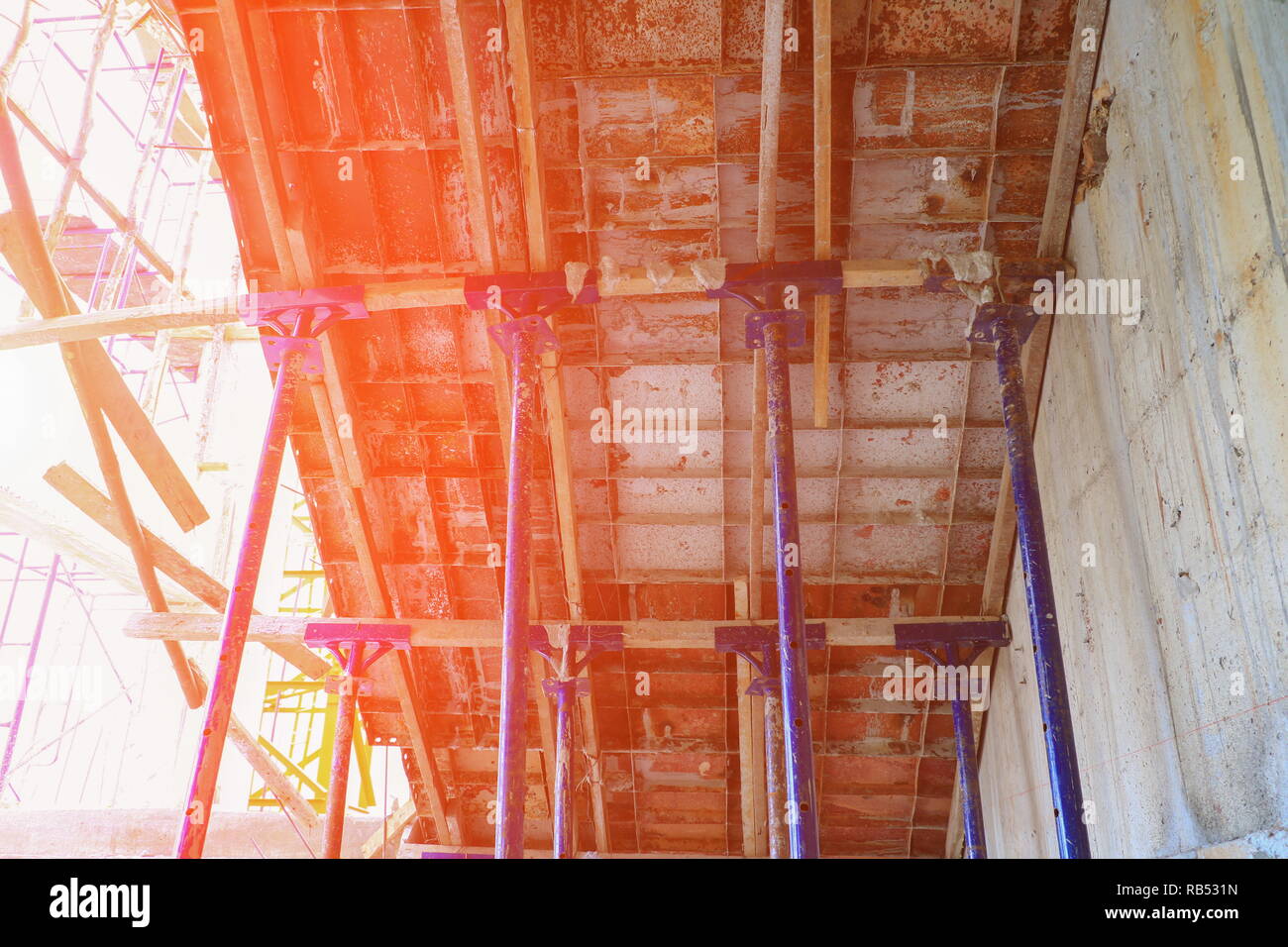 scaffolding steel group in work construction site building with sunset ...