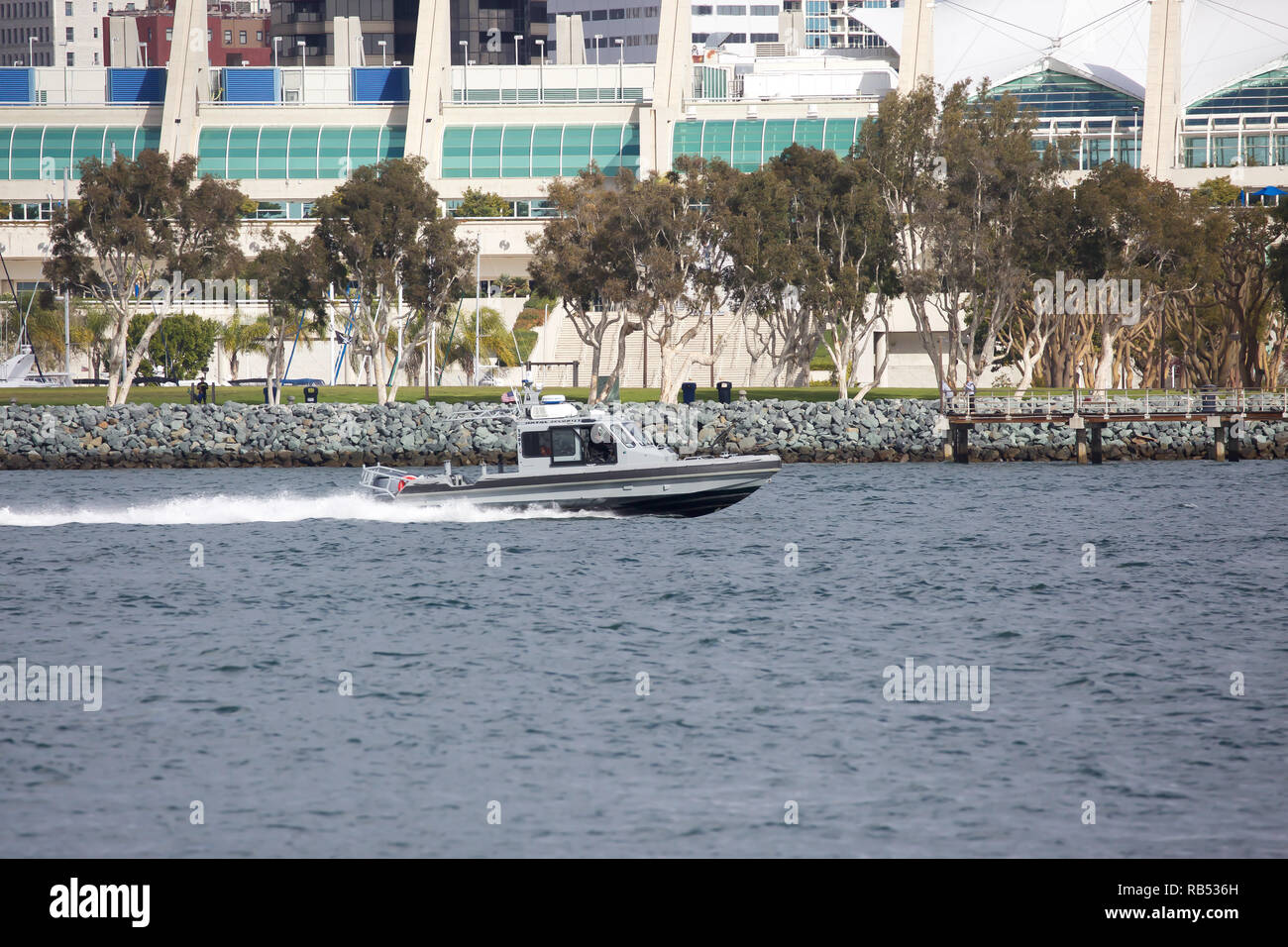 Small speedboat, possibly naval, speeds across San Diego Bay Stock ...