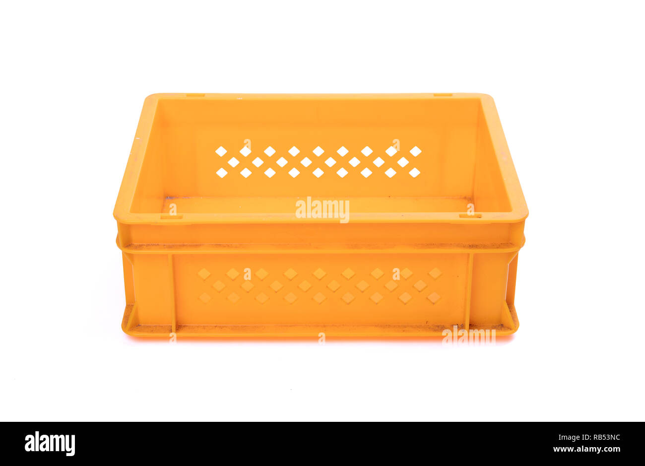 Empty yellow plastic crate isolated on white Stock Photo - Alamy