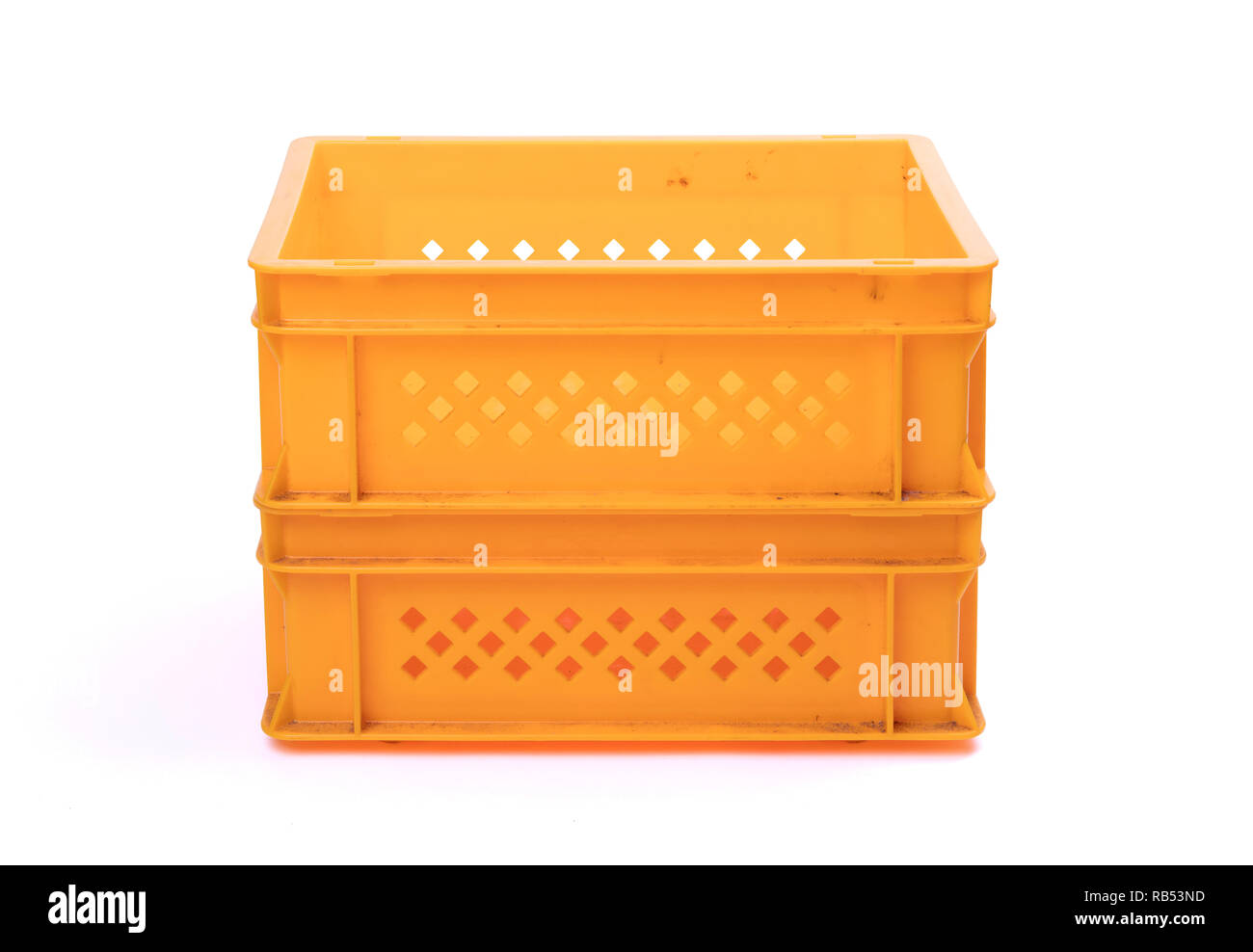Empty yellow plastic crates isolated on white Stock Photo - Alamy