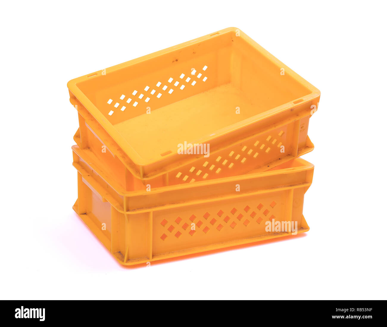 Empty yellow plastic crates isolated on white Stock Photo - Alamy