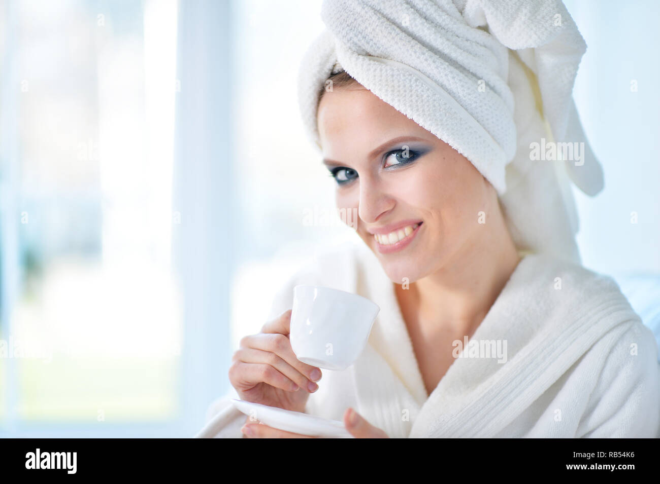 Woman after the shower bathrobe hi-res stock photography and images - Alamy