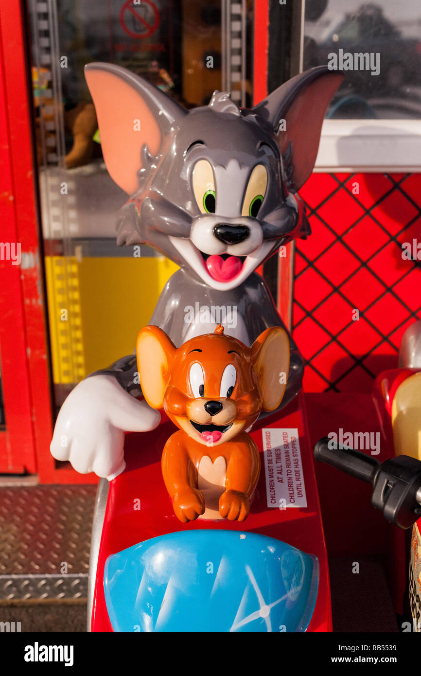 children's ride outside amusement arcade with cartoon characters Stock ...