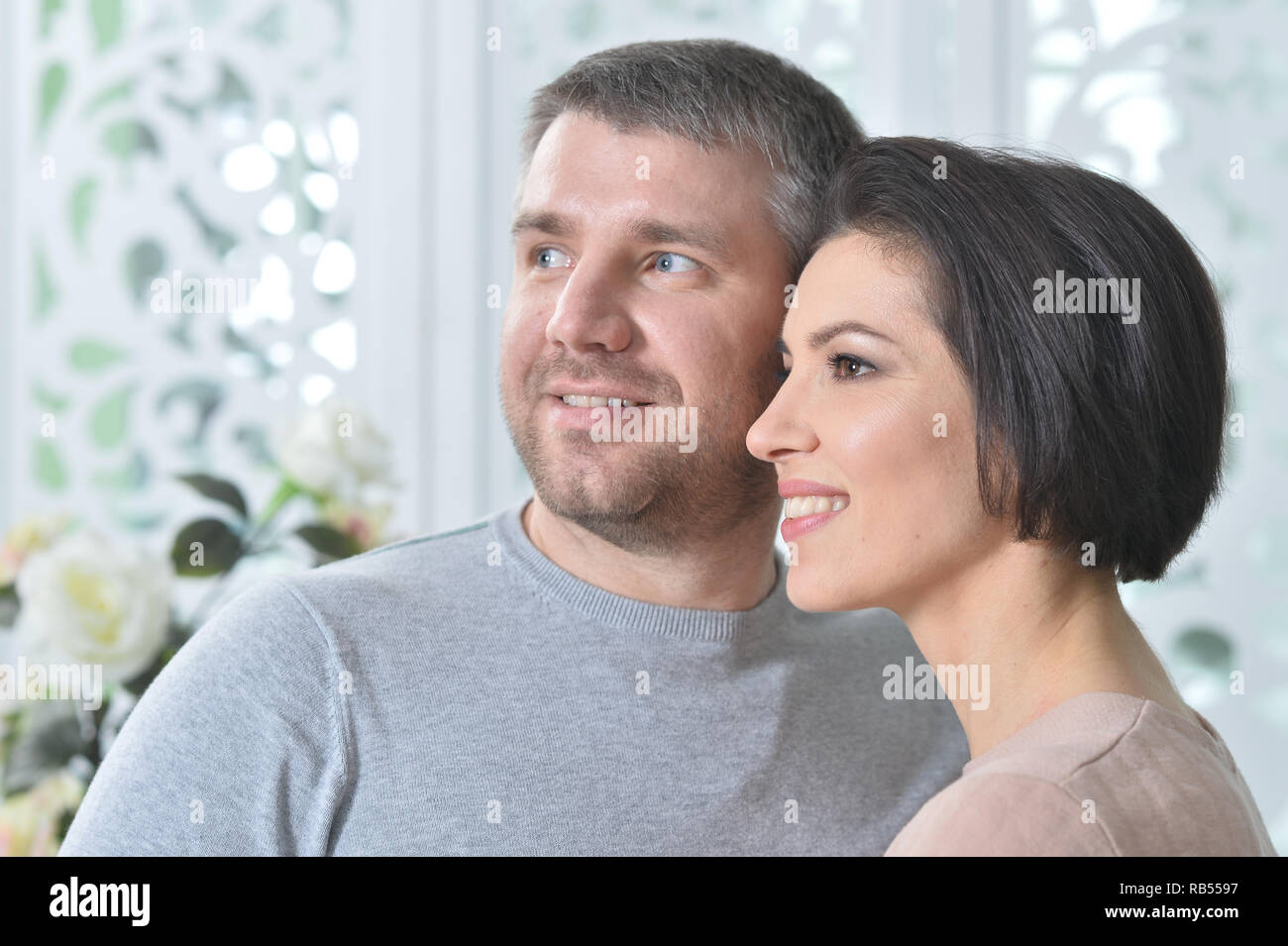 Portrait of happy beautiful a pretty couple posing Stock Photo - Alamy