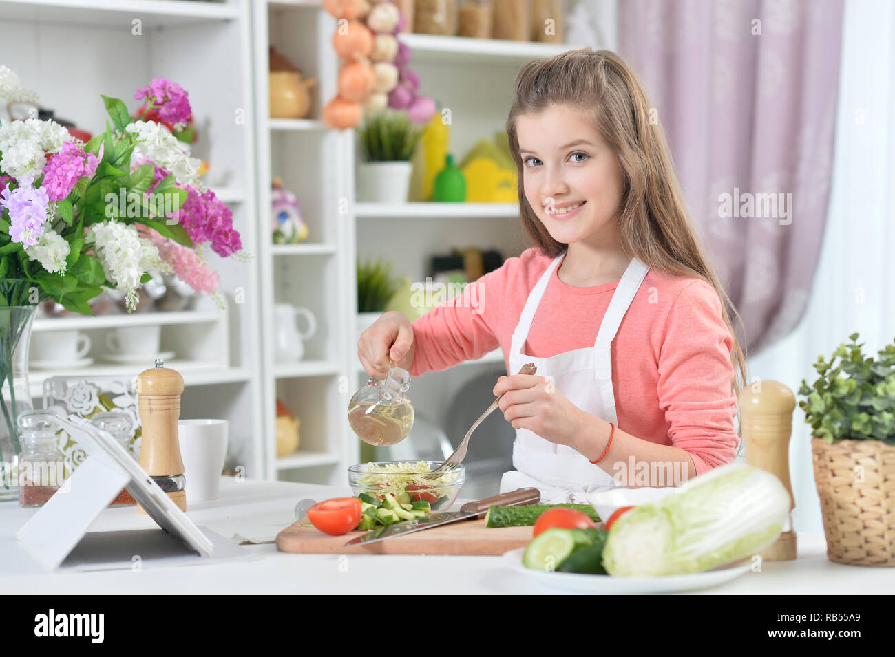 Portrait of young girl cooking in kitchen at home Stock Photo - Alamy