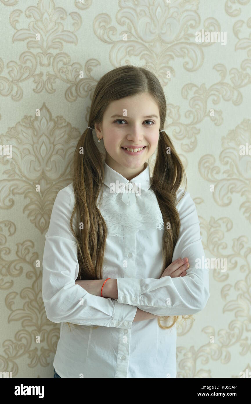 Portrait of cute happy little girl posing at home Stock Photo - Alamy