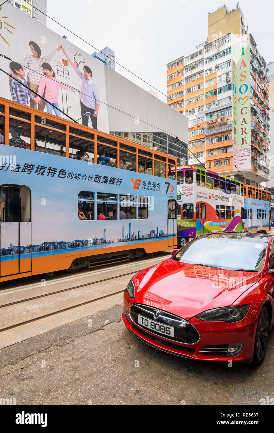 Tesla and trams on Johnston Rd, Wan Chai, Hong Kong Stock Photo - Alamy