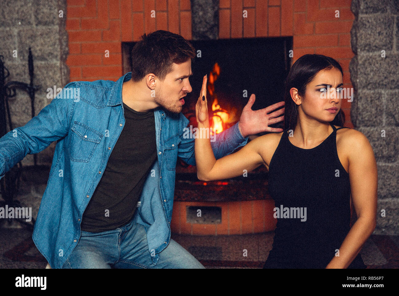 Rude young man angry on young woman. He wave with left hand. Model ...