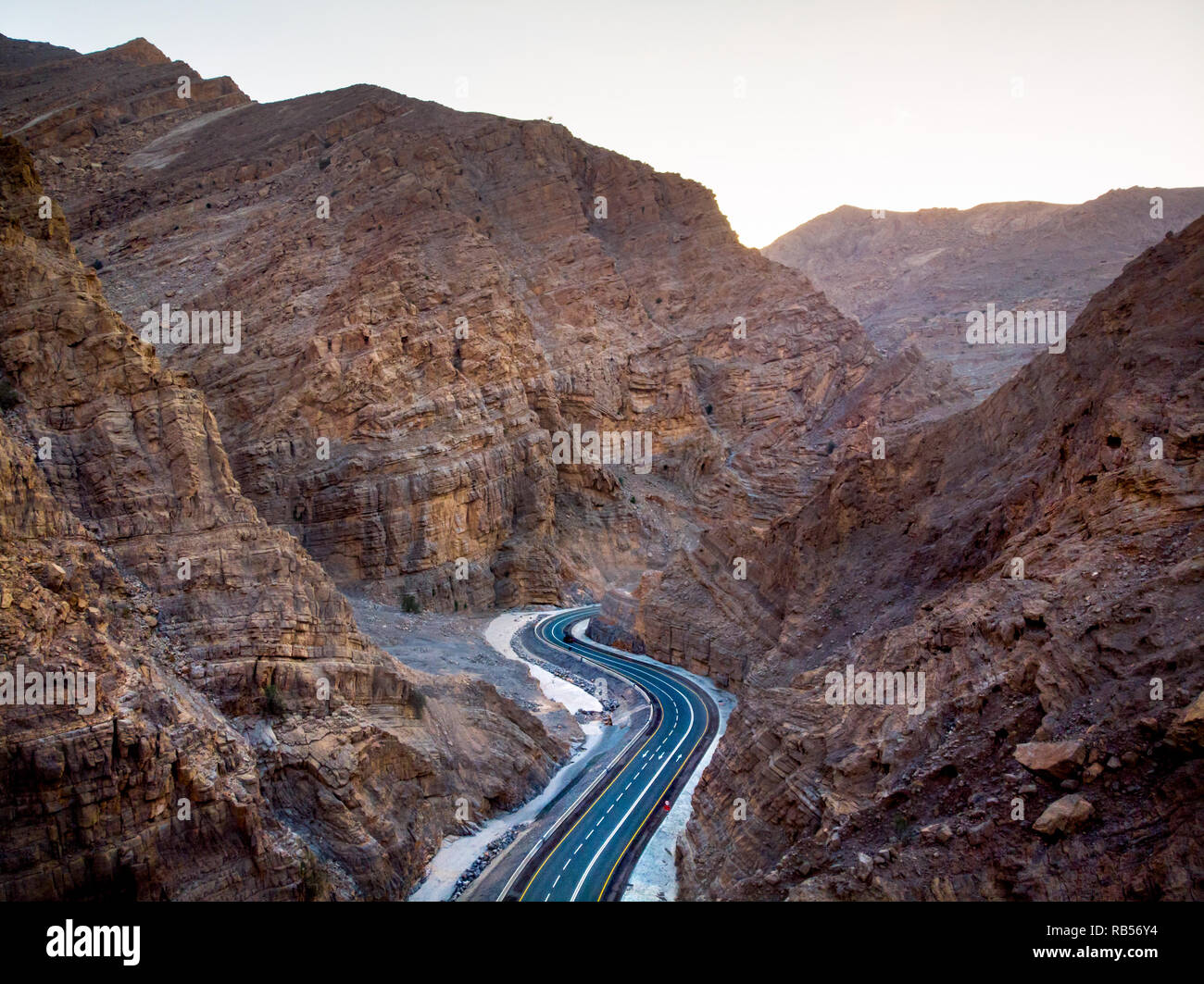 Desert road surrounded by sandstone rocks aerial view Stock Photo - Alamy