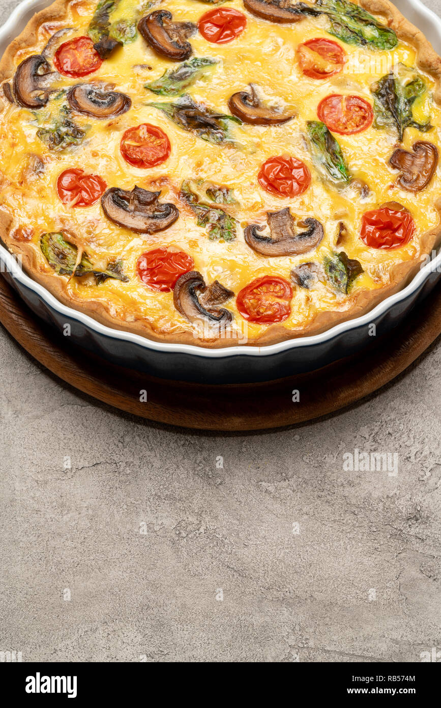 Baked homemade quiche pie in ceramic baking form Stock Photo - Alamy
