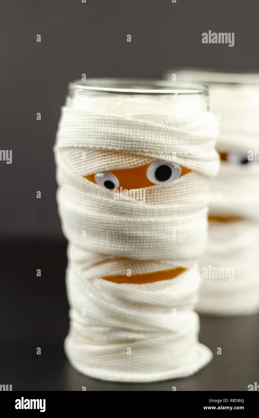 glass of beer decorated like an Egyptian mummy, a drink for a halloween ...