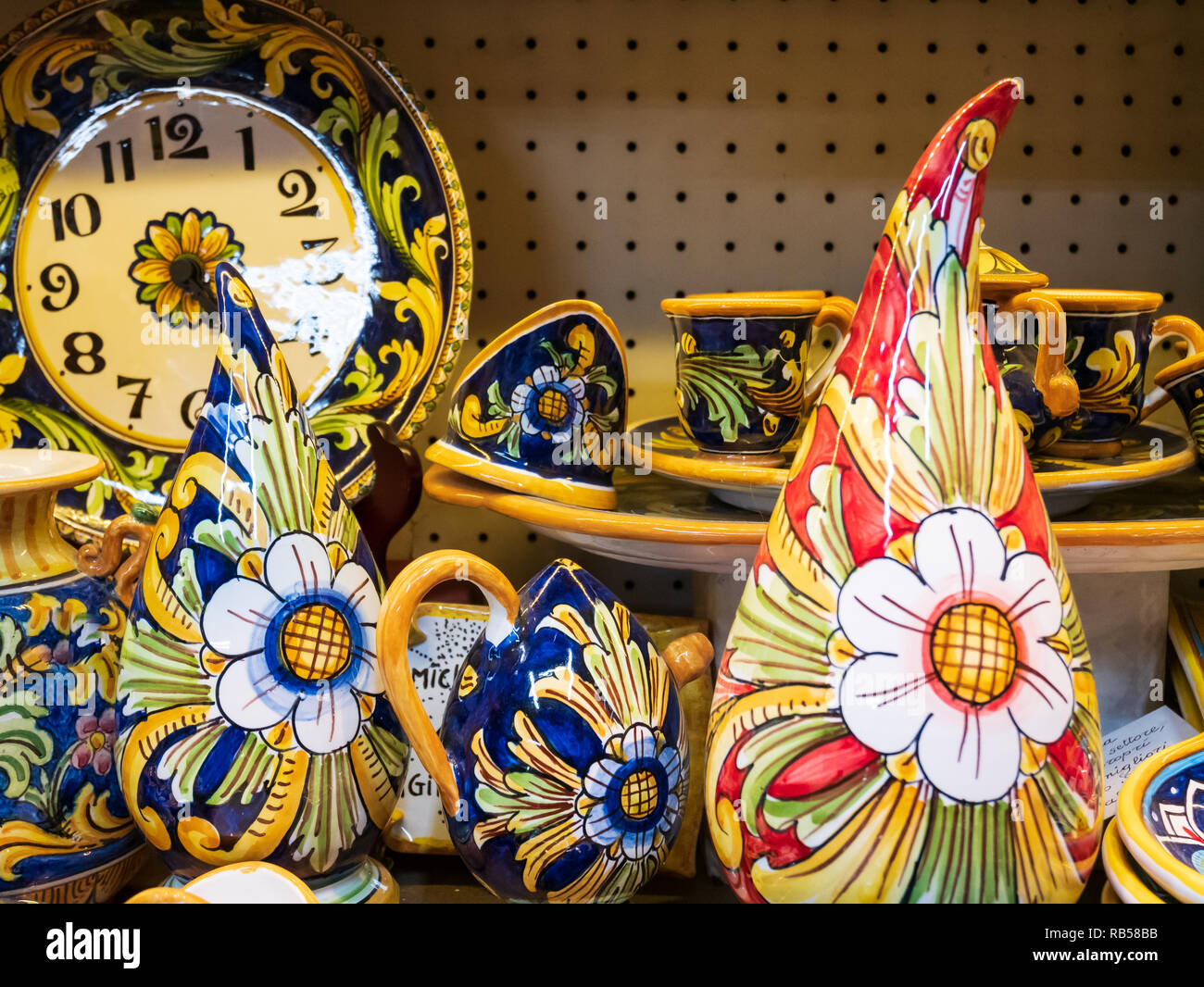 Various hand-painted ceramic objects on display for sale. Horizontal ...