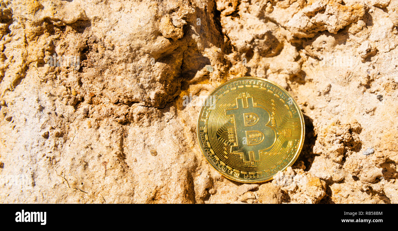 Crypto currency Gold Bitcoin, BTC, macro shot of Bitcoin coins on rock ...